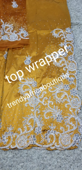 Exclusive design. Gold silk George wrapper beaded and stoned with whit ...